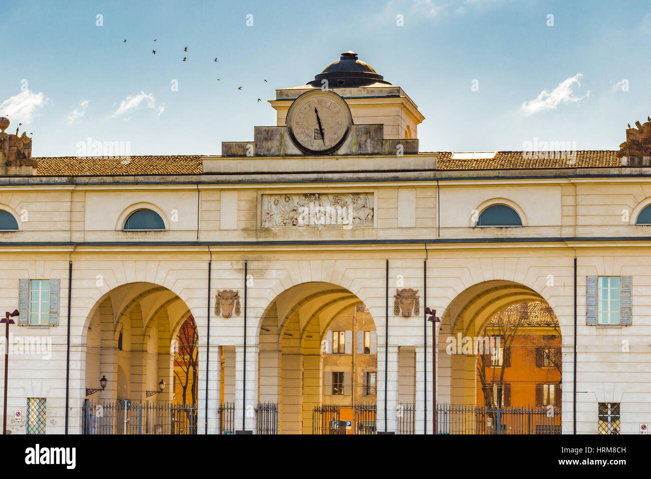 ancient clock on white building in Modena Stock Photo - Alamy