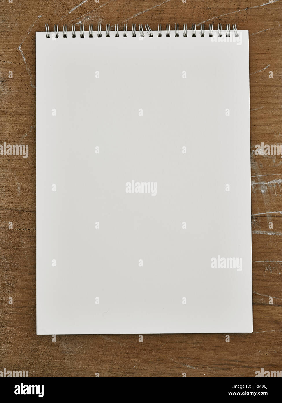 spiral bound Notepad on wooden table Stock Photo - Alamy