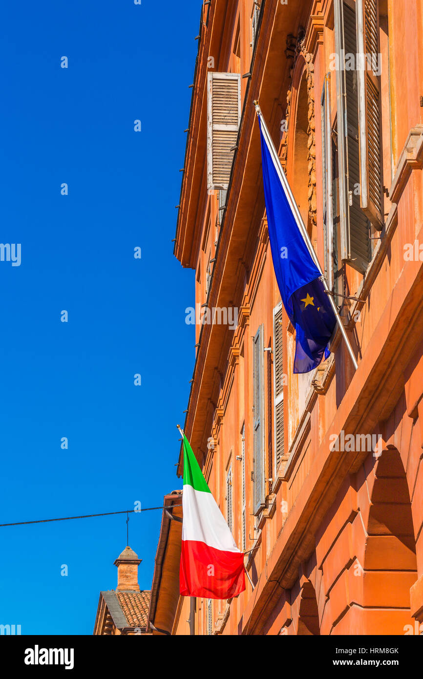 Italian and Europe flags on the Architecture of the colorful buildings ...