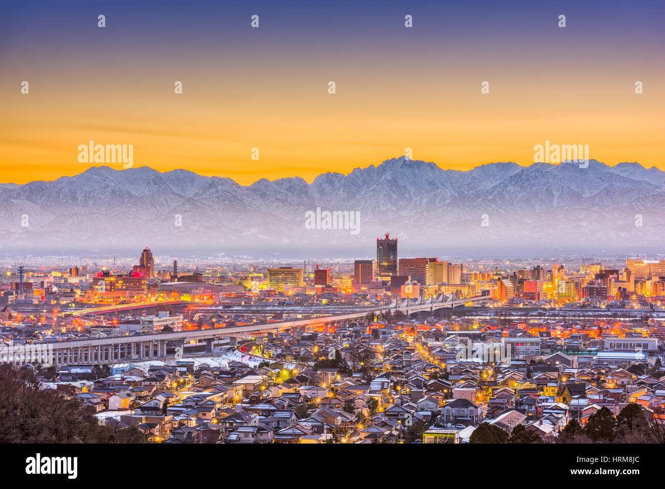 Toyama City, Japan downtown skyline with background mountains at dawn ...