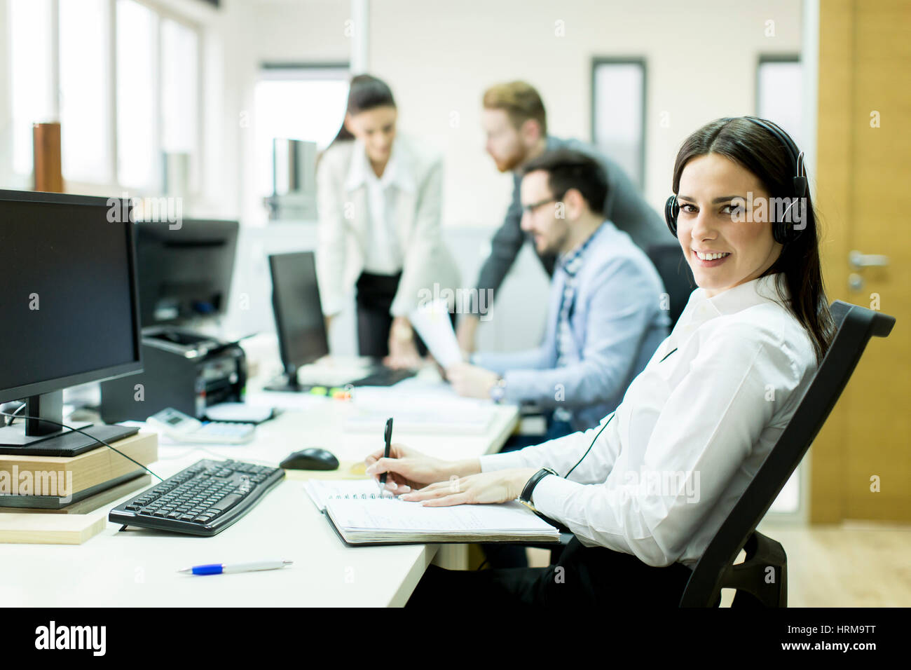 People working in a busy office. Teamwork Stock Photo - Alamy