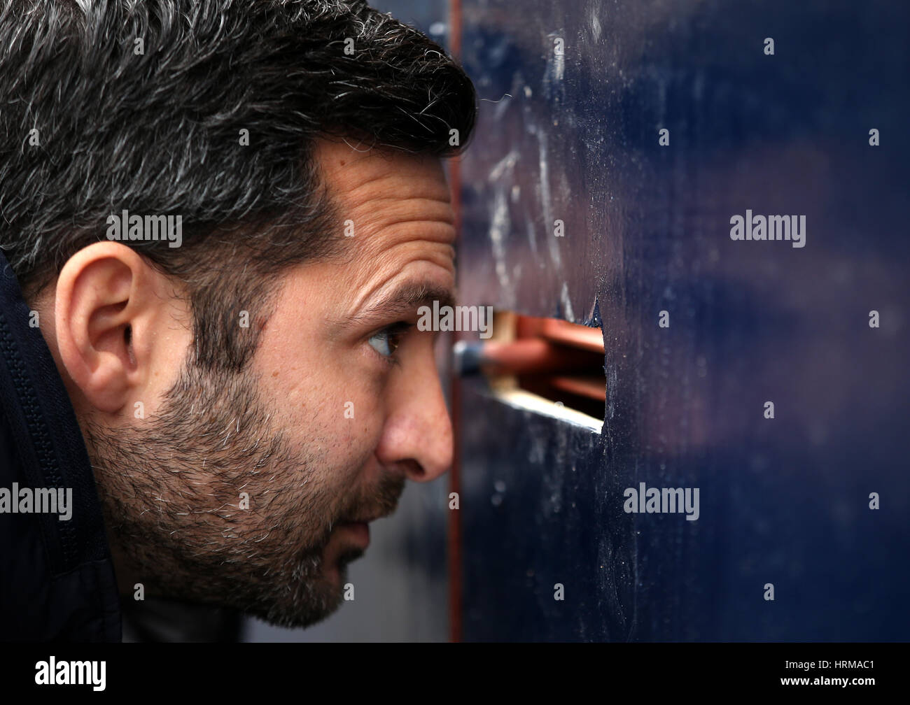 A fan looks through a wall at the building works Stock Photo - Alamy