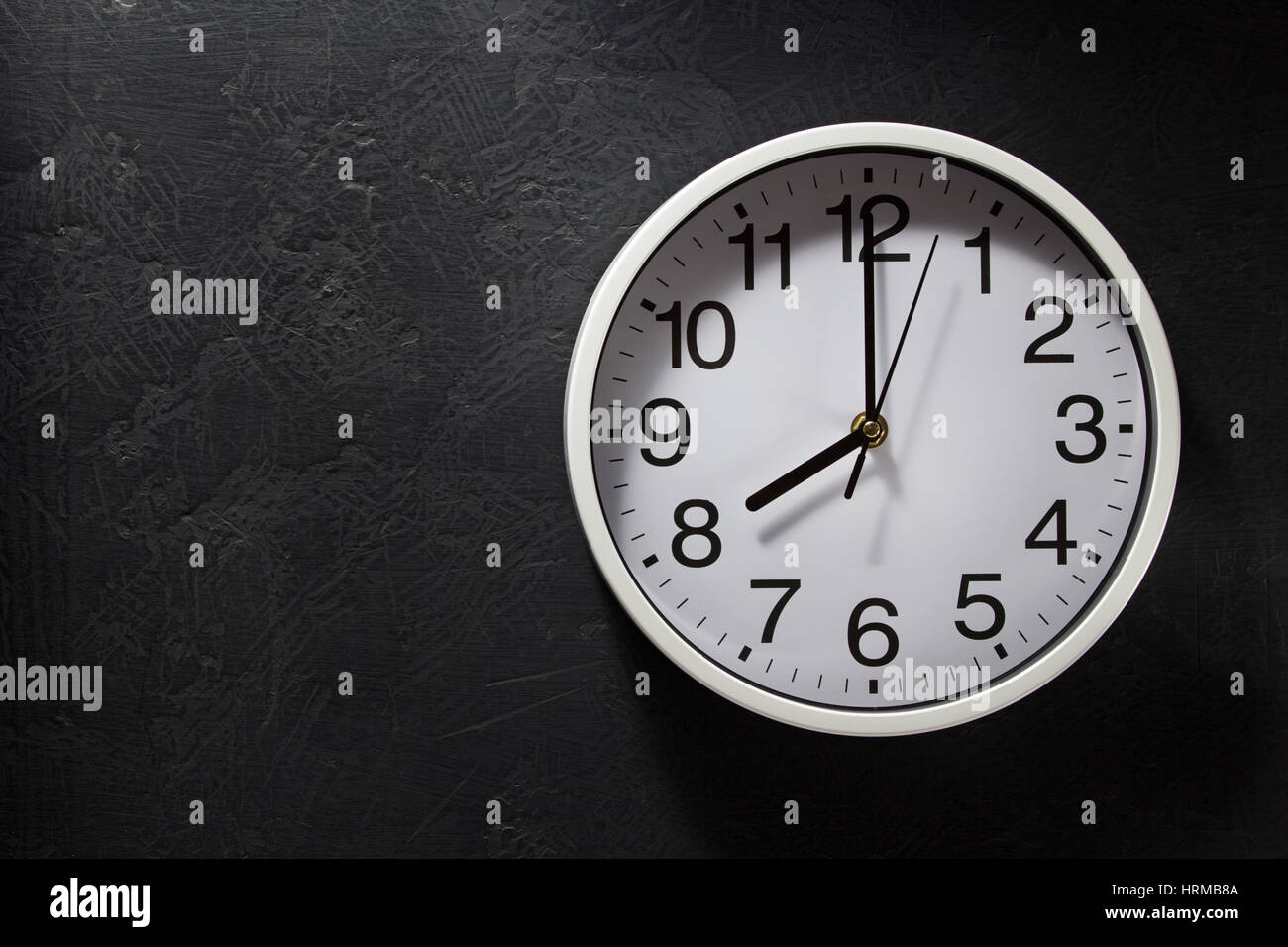 wall clock at black background texture Stock Photo - Alamy