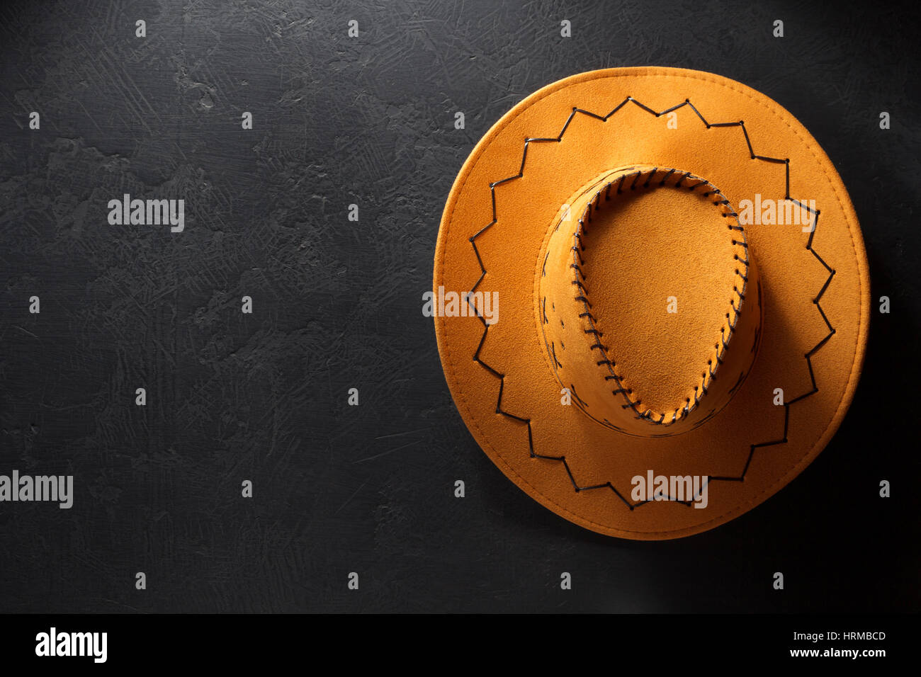 cowboy hat on black background texture Stock Photo - Alamy
