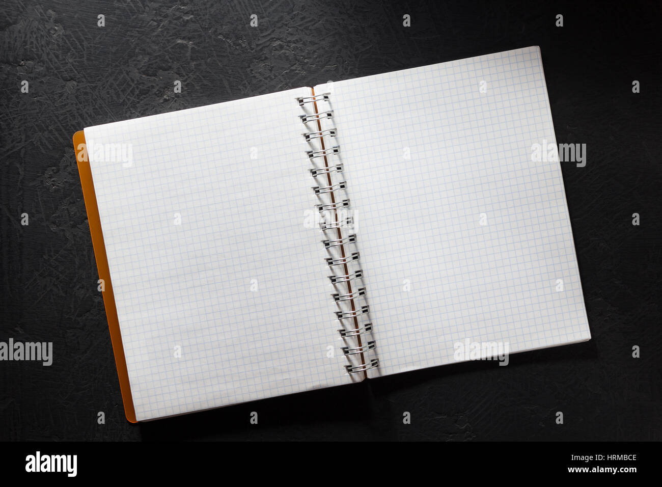 school checked notebook on black background Stock Photo - Alamy