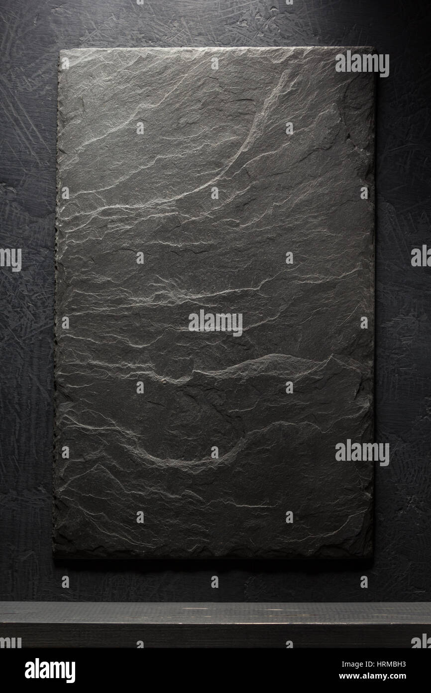 slate stone and shelf on black background Stock Photo - Alamy