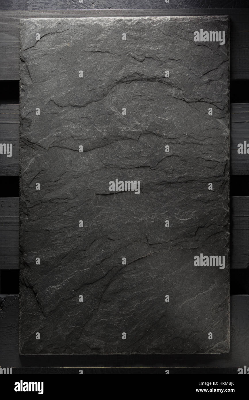 slate stone at wooden background texture Stock Photo - Alamy