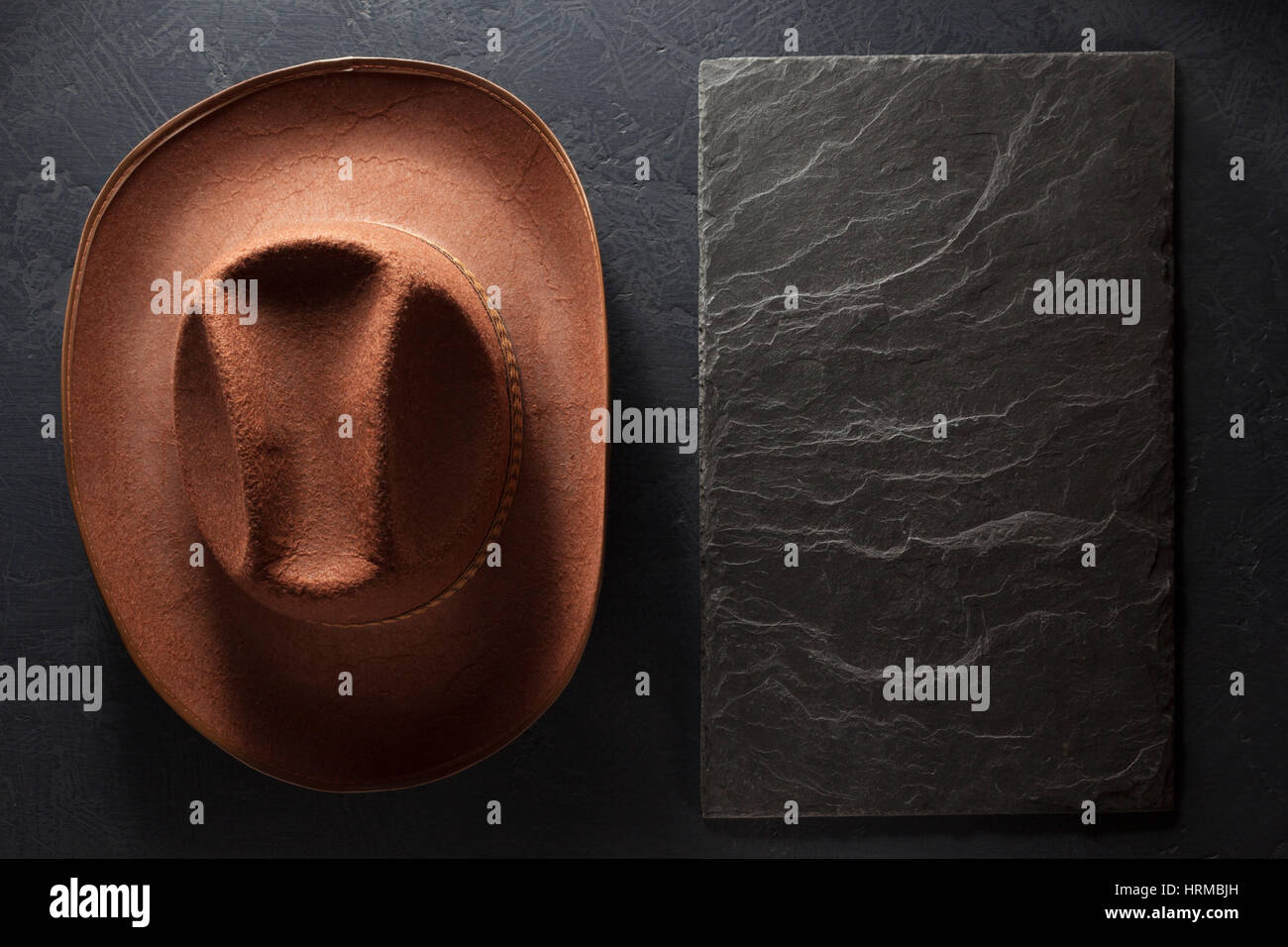cowboy hat on black background texture Stock Photo - Alamy