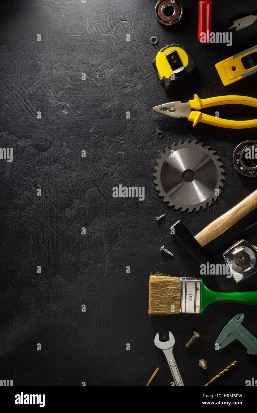 set of tools and instruments on black background Stock Photo - Alamy