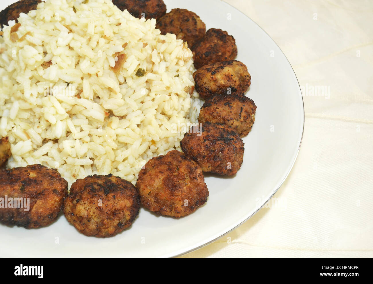 greek rice pilaff with baked meatballs Stock Photo - Alamy