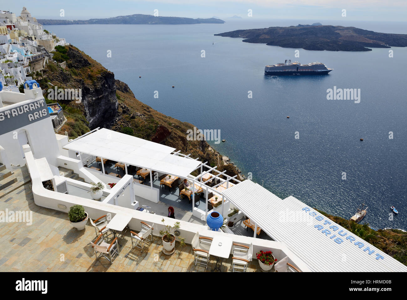 FIRA, GREECE - MAY 17: The view on Fira town and tourists enjoying ...