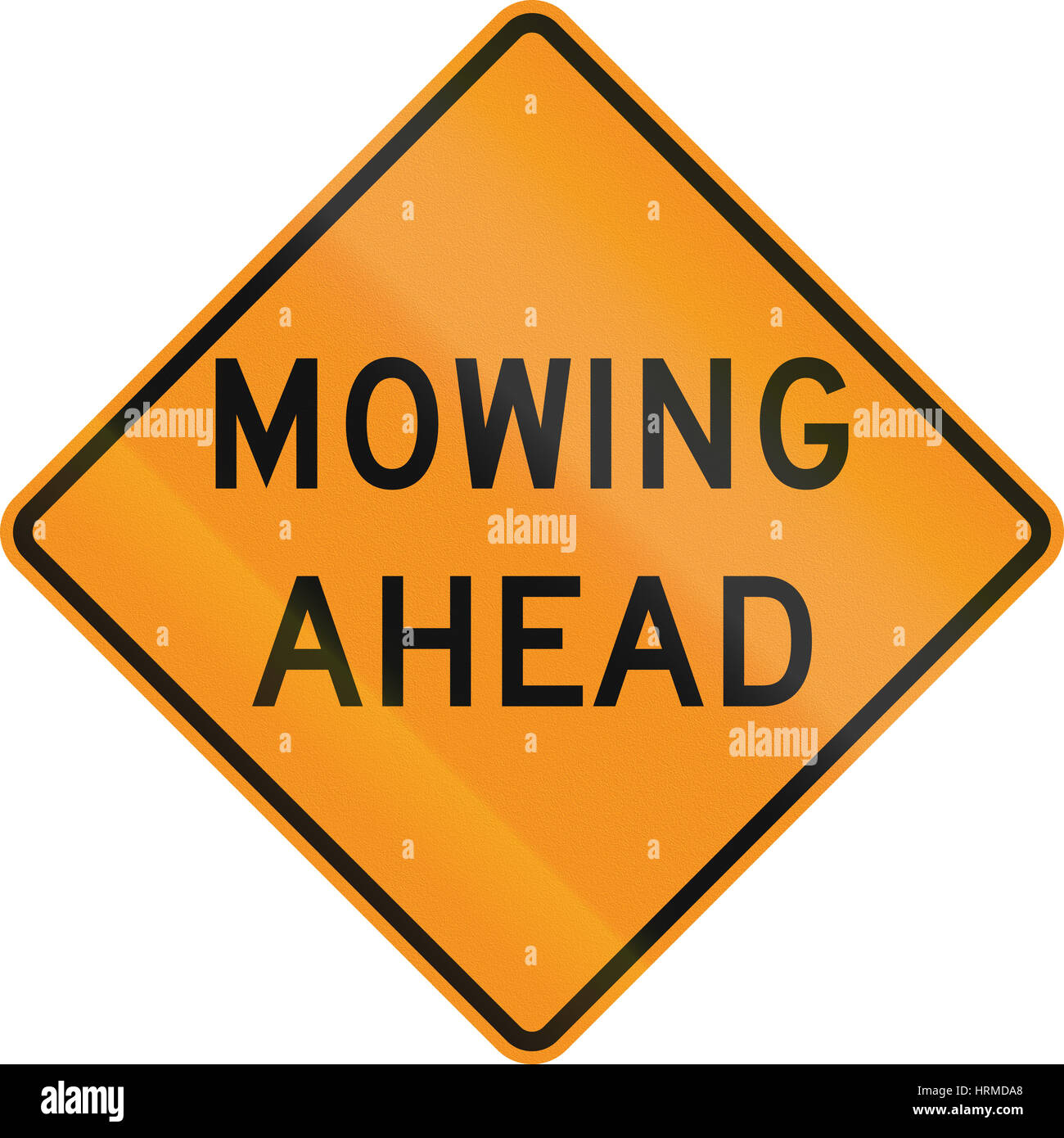 United States MUTCD road sign - Mowing ahead Stock Photo - Alamy