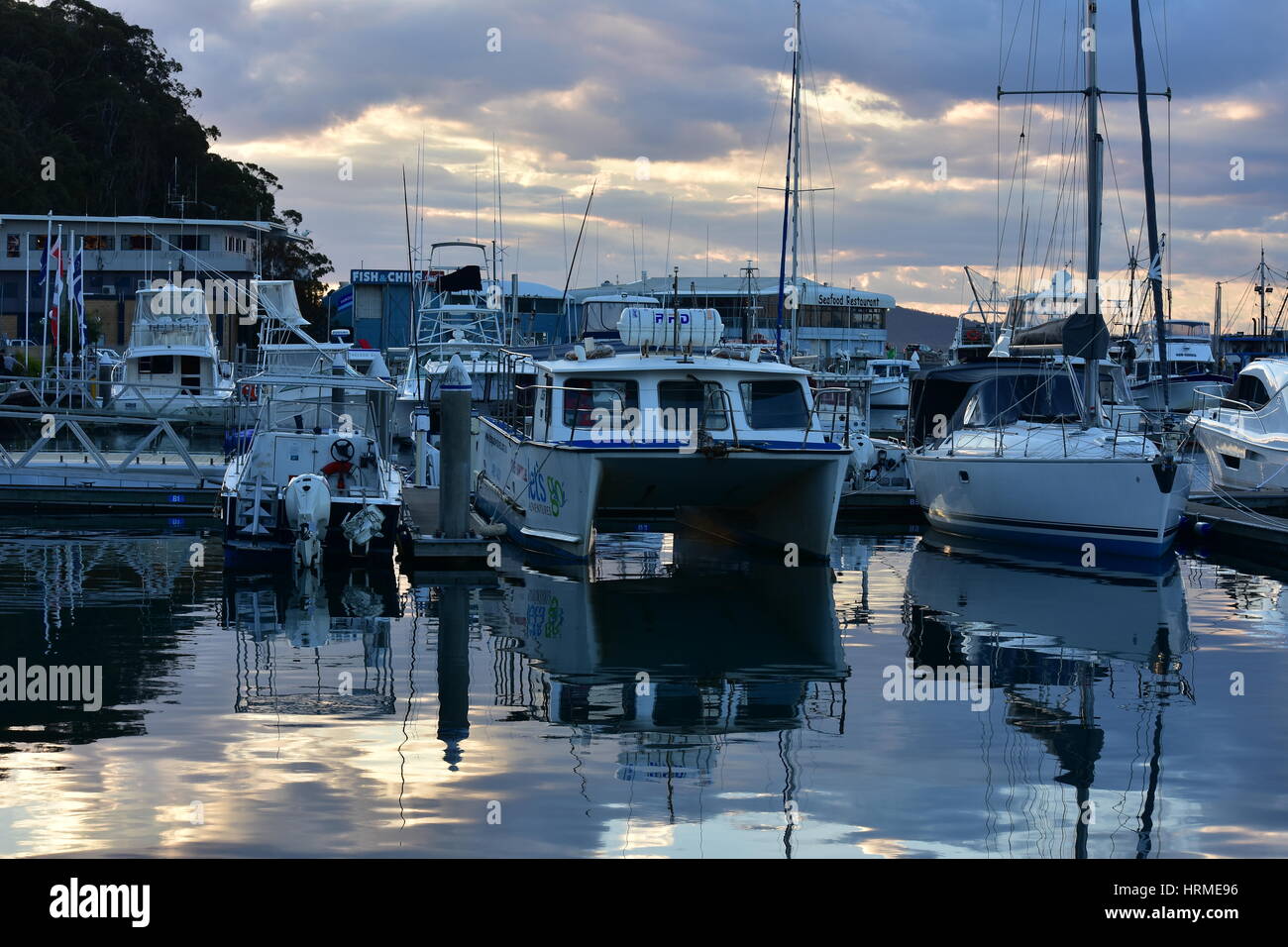 Recreational and commercial vessels berthed in marina in Nelson Bay ...