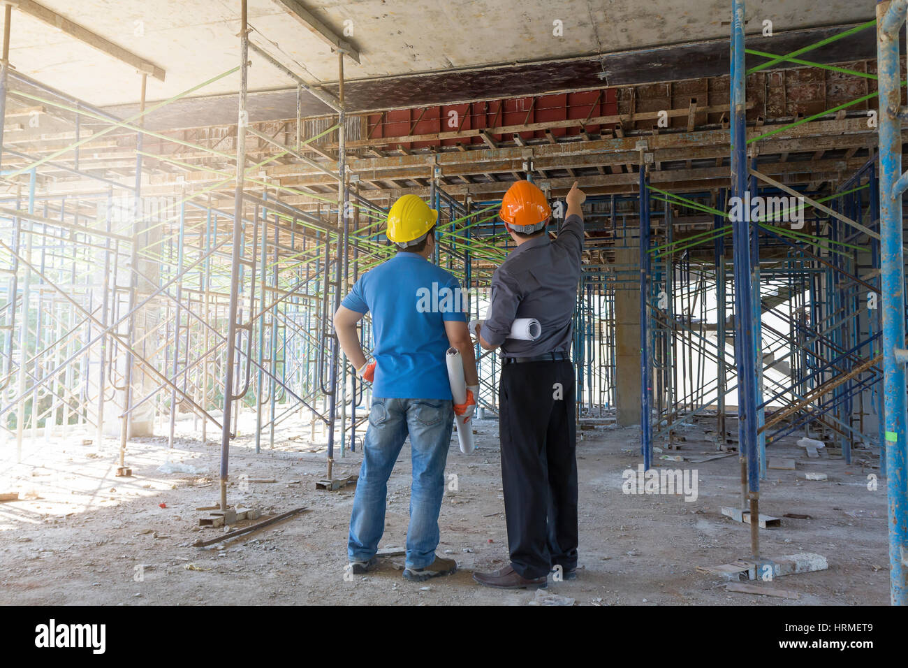 Construction concepts, Engineer and Architect working at Construction Site with blueprint Stock ...