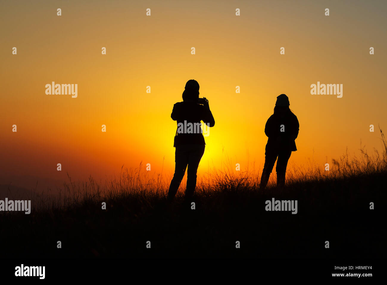 Silhouette Of People having fun at sunset time Stock Photo - Alamy