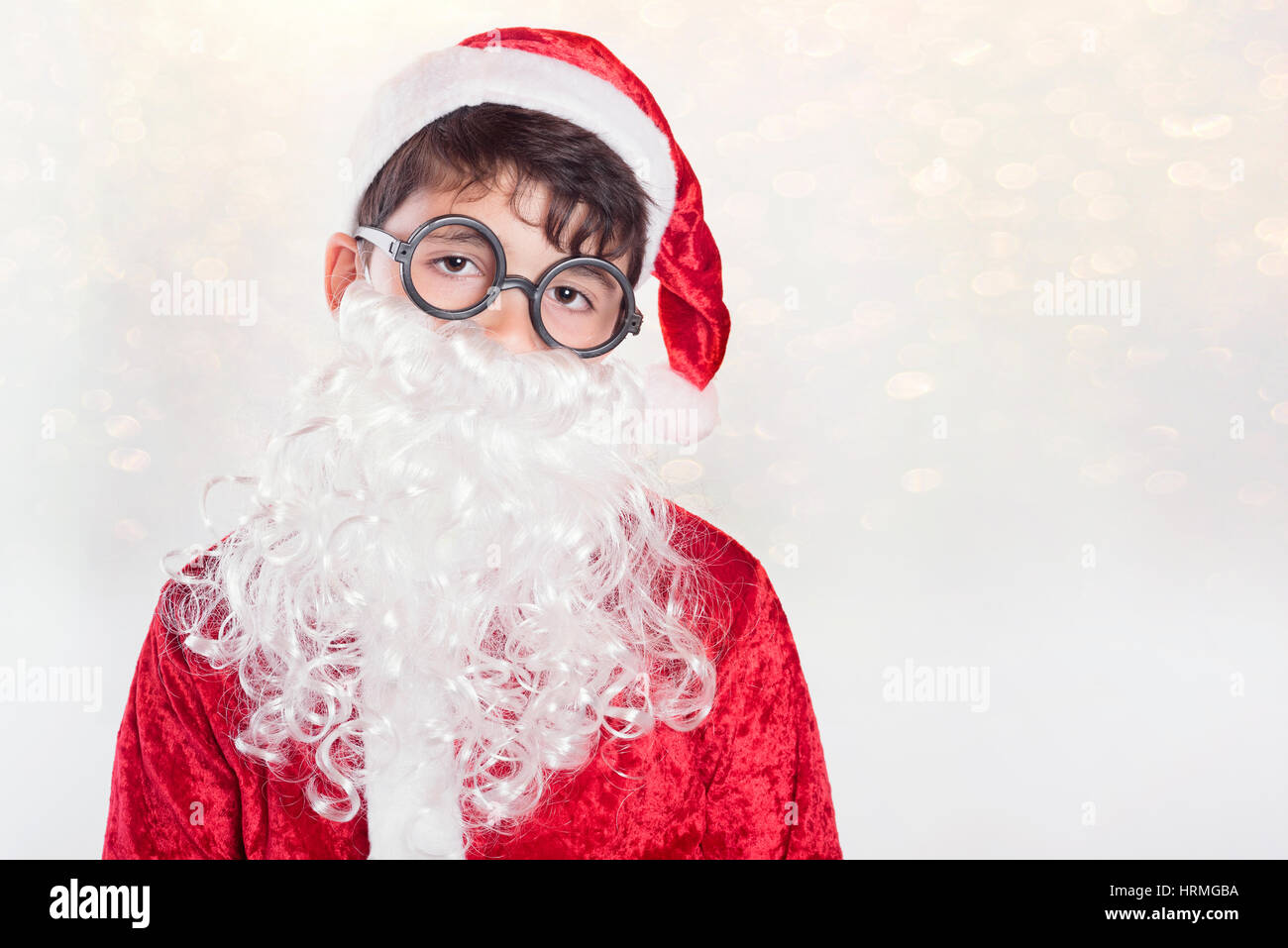 Merry Christmas. Boy dressed as Santa Claus Stock Photo - Alamy