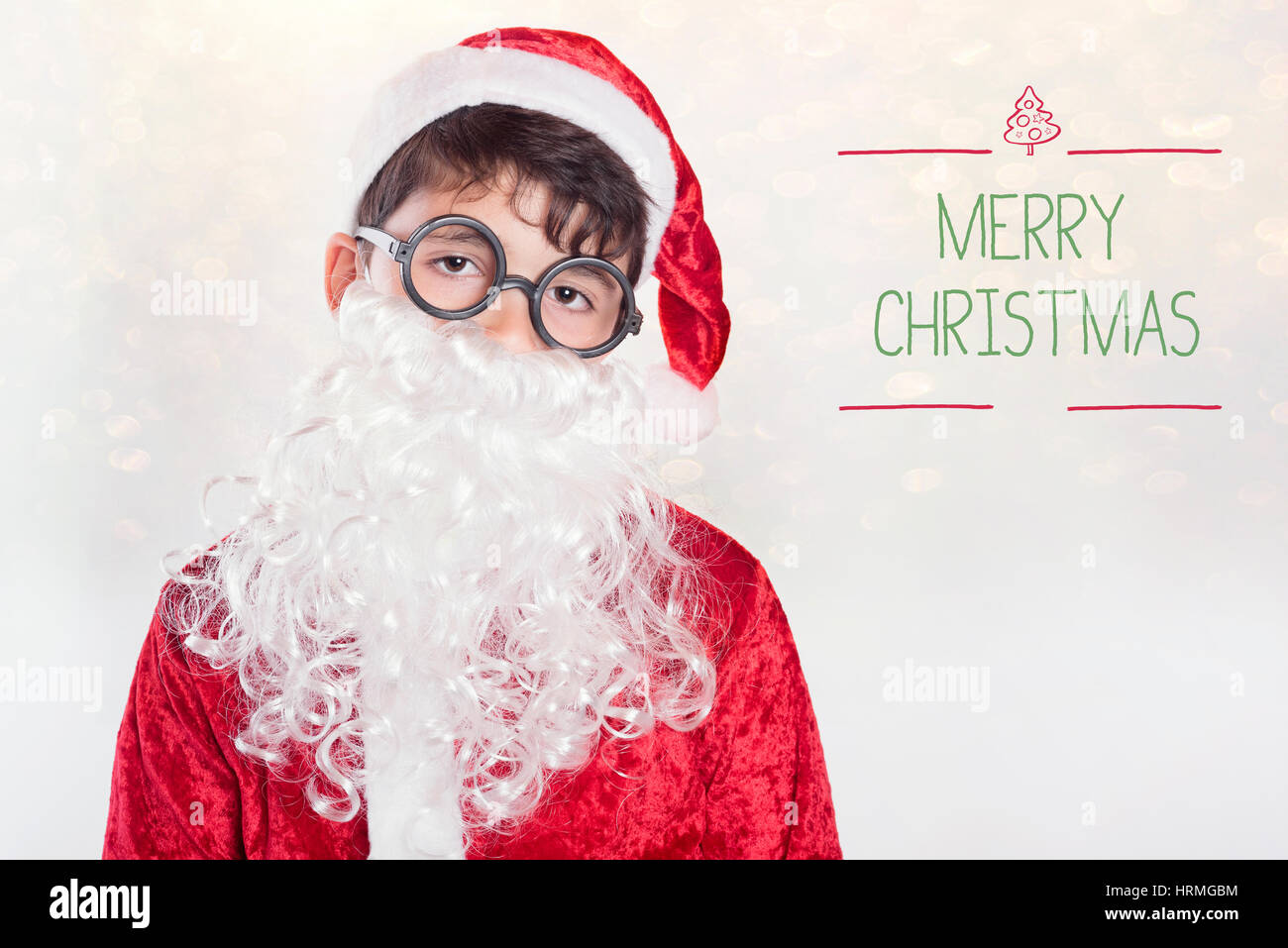 Merry Christmas. Boy dressed as Santa Claus Stock Photo - Alamy