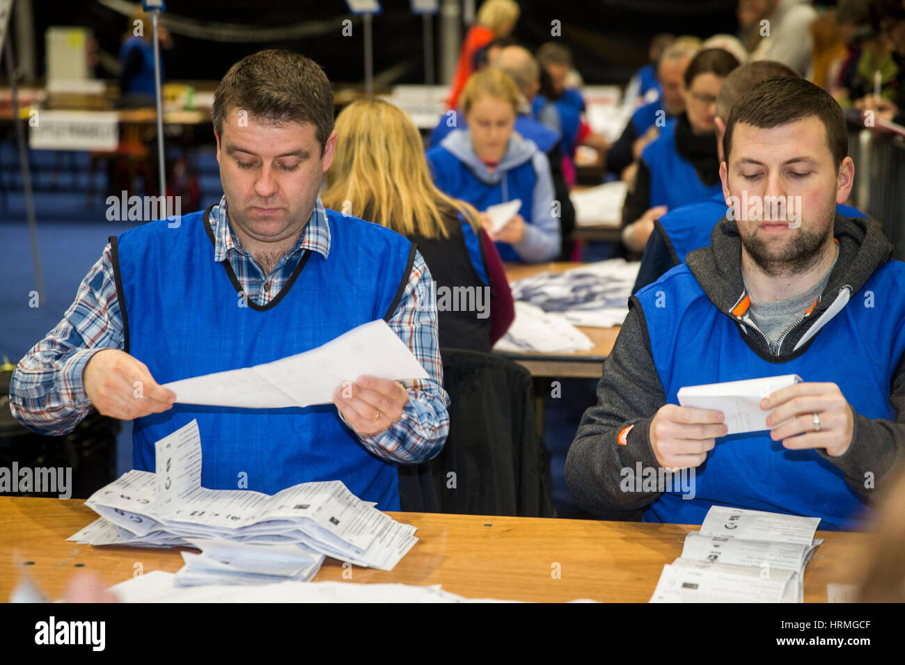 Election count staff count ballot papers at the main Belfast count ...