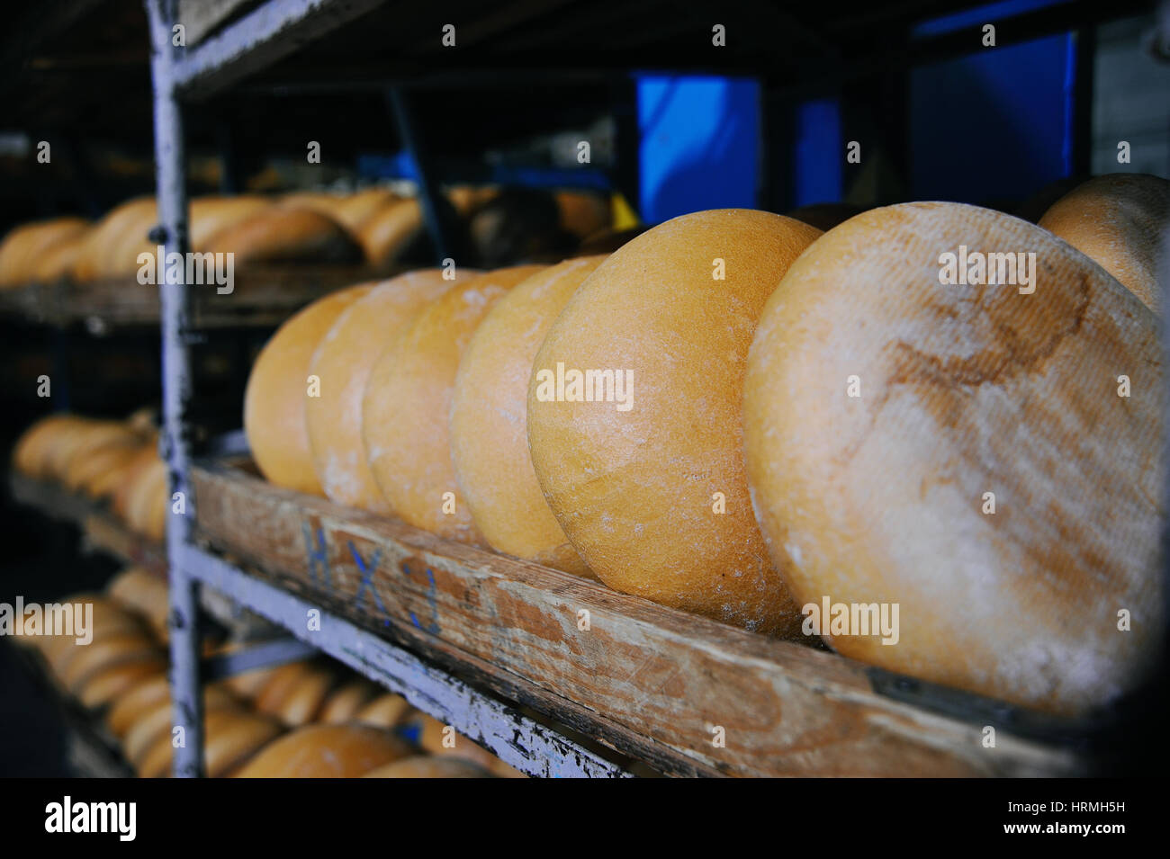 many loaves of fresh bread on a shelf in a bakery Stock Photo - Alamy