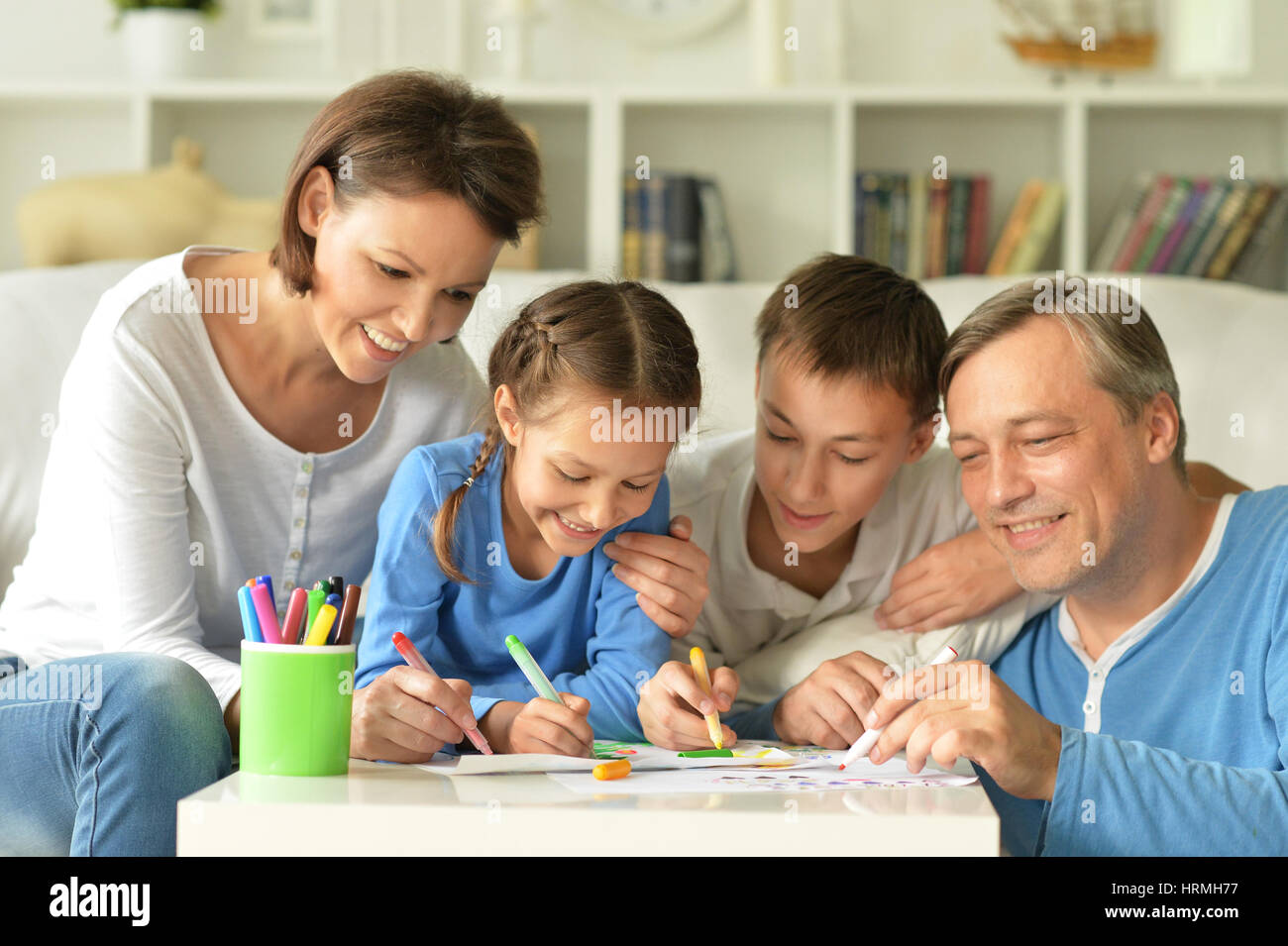 Big happy family drawing together hi-res stock photography and images ...