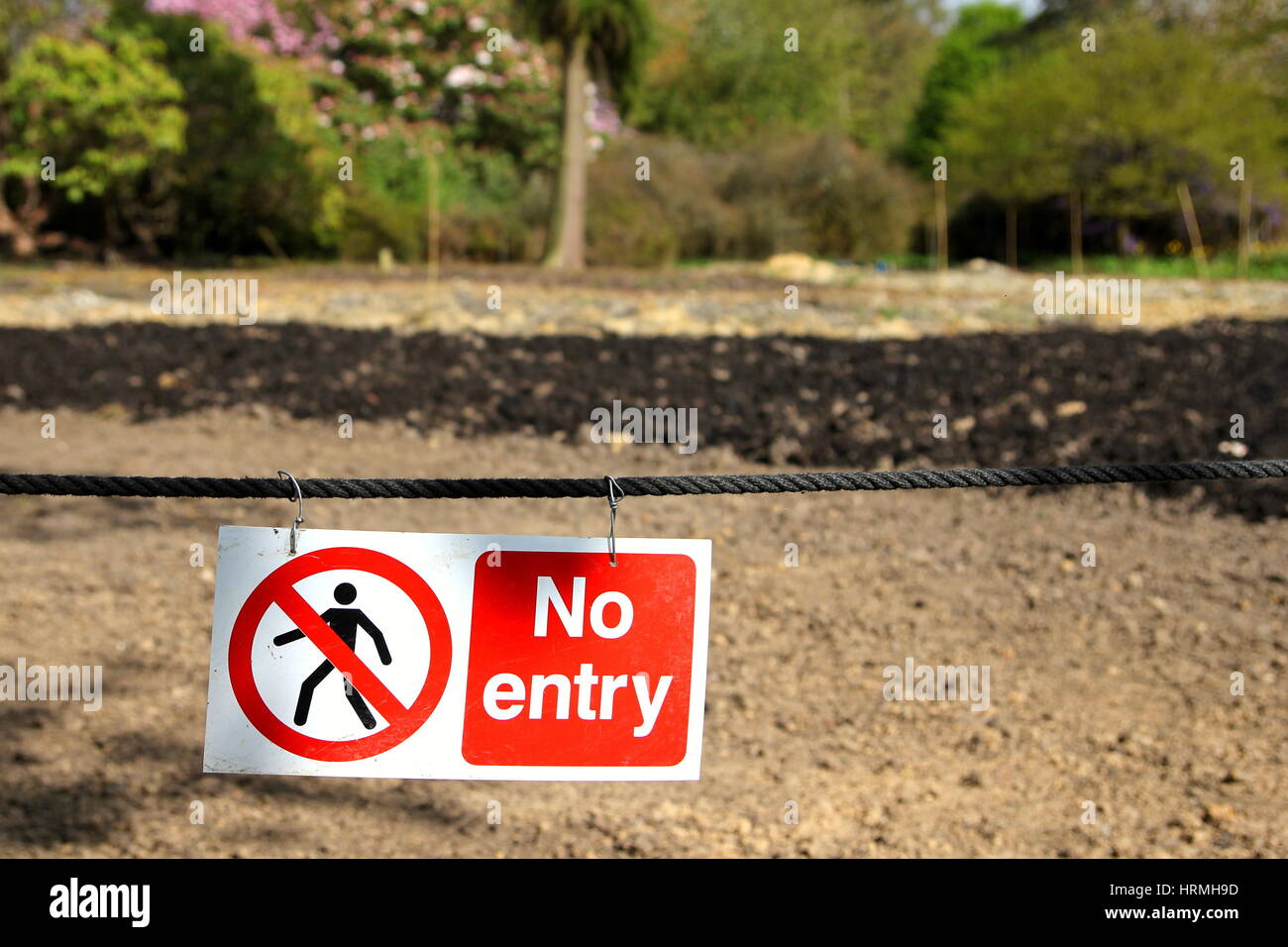 No entry sign hanging in front of some muddy ground Stock Photo - Alamy