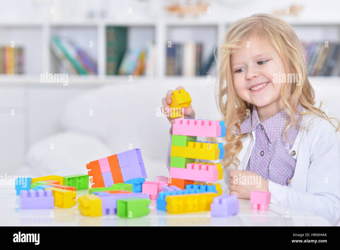 happy cute little girl playing lego game Stock Photo - Alamy