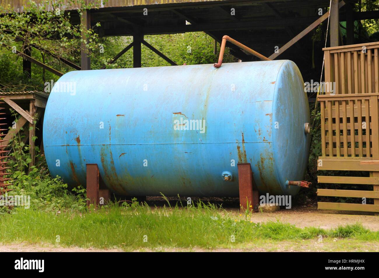 Old metal farmyard tank Stock Photo - Alamy