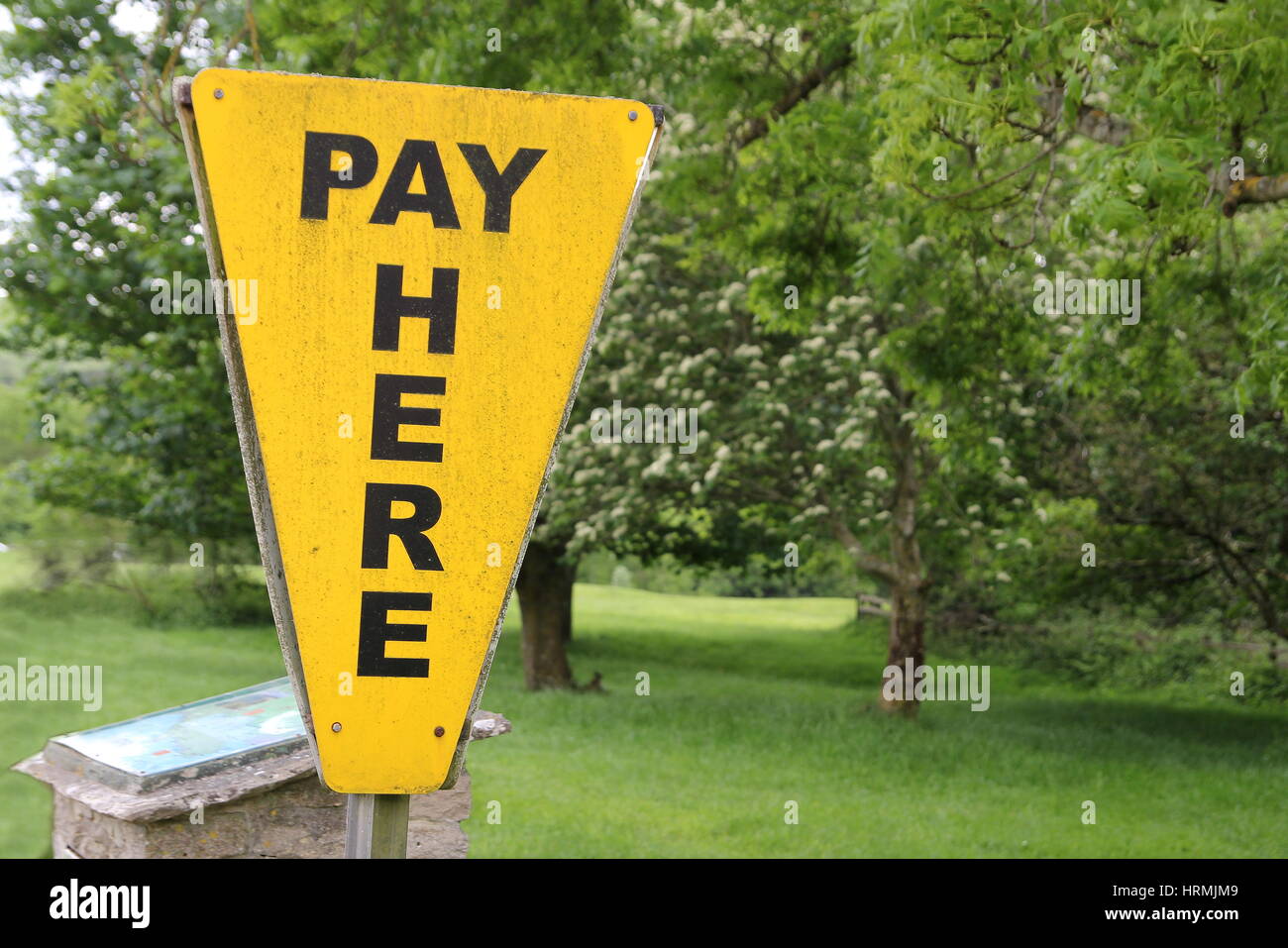 Pay here sign Stock Photo - Alamy