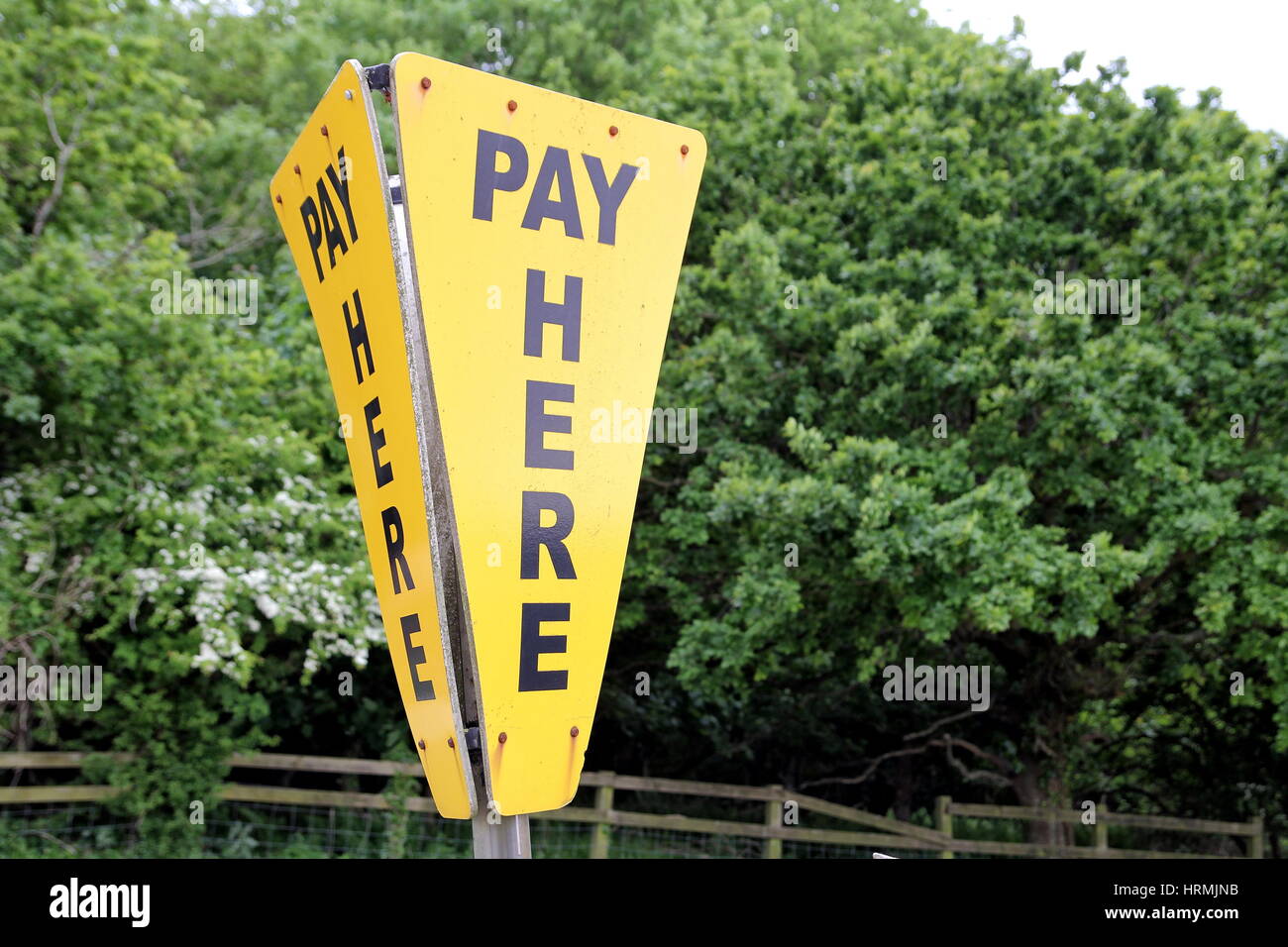 Pay here sign Stock Photo - Alamy