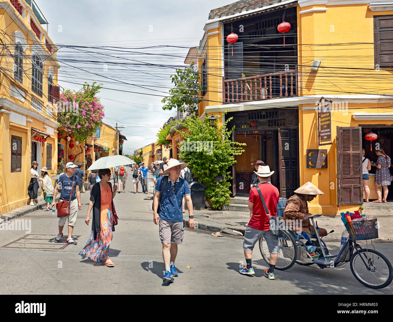 People walking in the street in Hoi An Ancient Town. Hoi An, Quang Nam ...