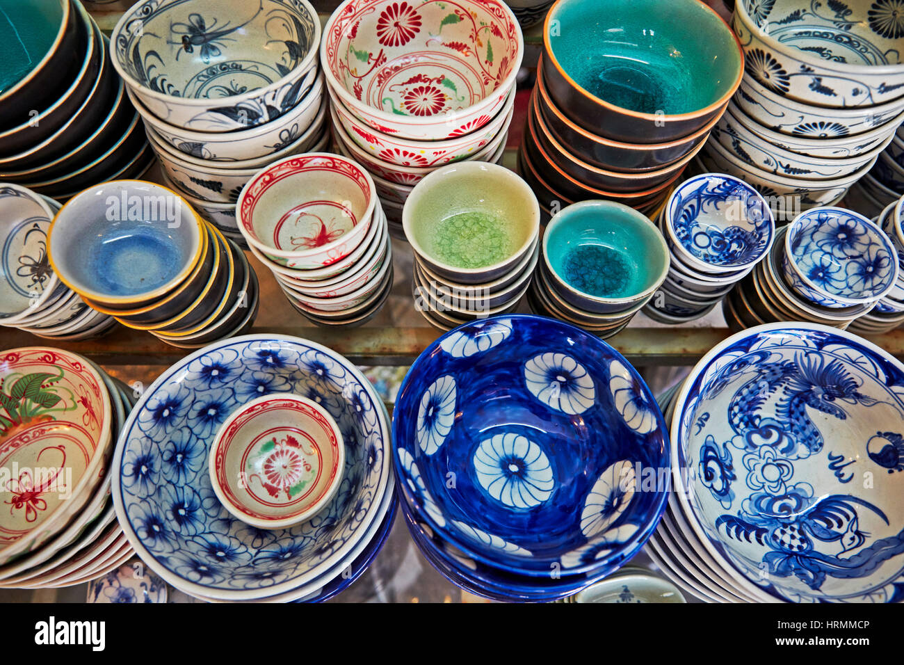 A selection of traditional Vietnamese ceramic bowls displayed for sale ...