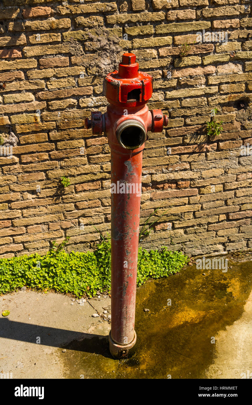 Old red fire hydrant in Rome, Italy Stock Photo - Alamy