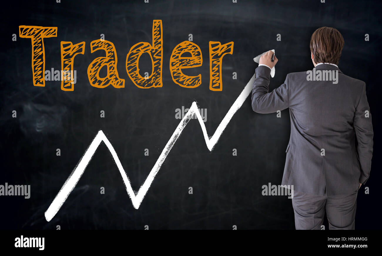 Businessman writing trader on blackboard concept Stock Photo - Alamy