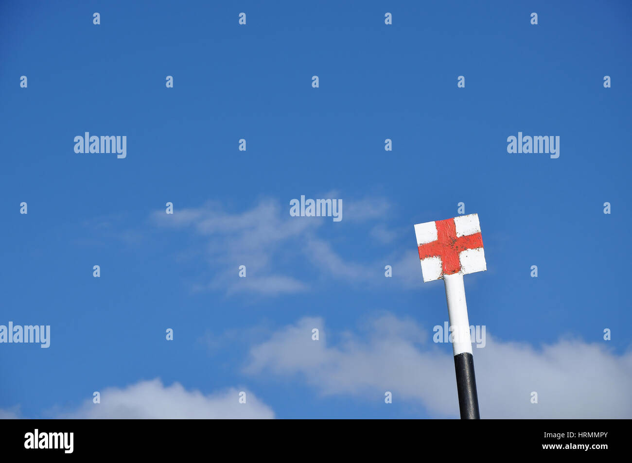 Trekking signpost in the mountains. Red cross on white background ...