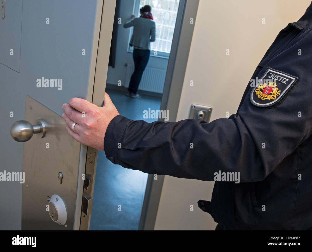 Bremerhaven, Germany. 27th Feb, 2017. A prison officer holds a door ...