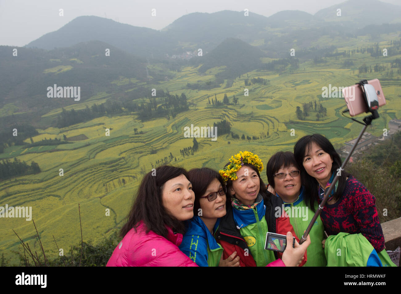 Luoping, China's Yunnan Province. 2nd Mar, 2017. Tourists take photo of ...