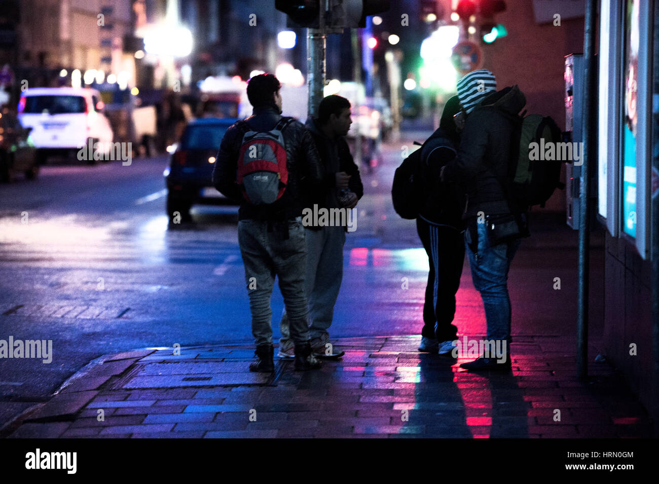 Young men wait on a street corner in Munich, Germany, 21 February 2017 ...