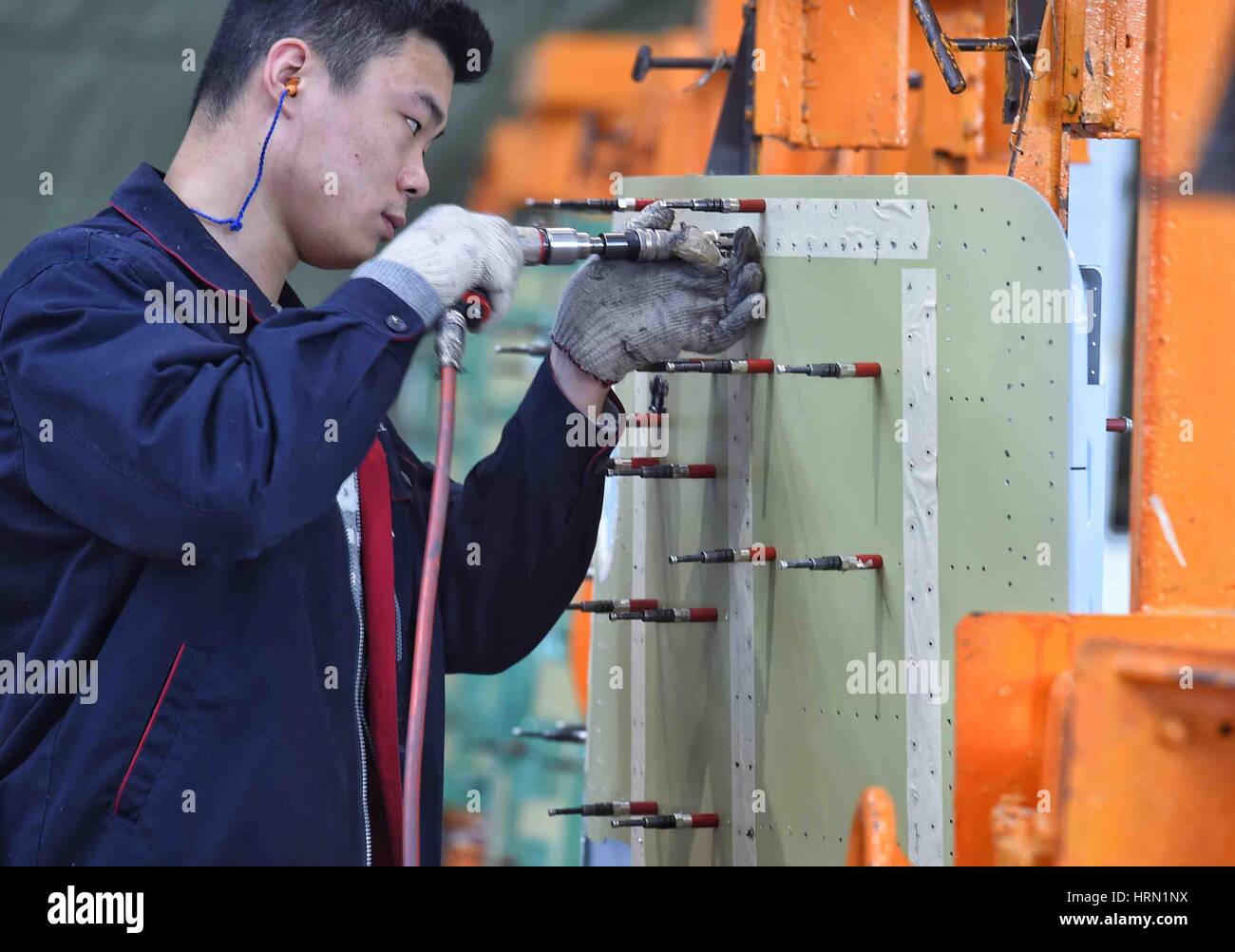 Chengdu, China's Sichuan Province. 3rd Mar, 2017. A man works at the ...
