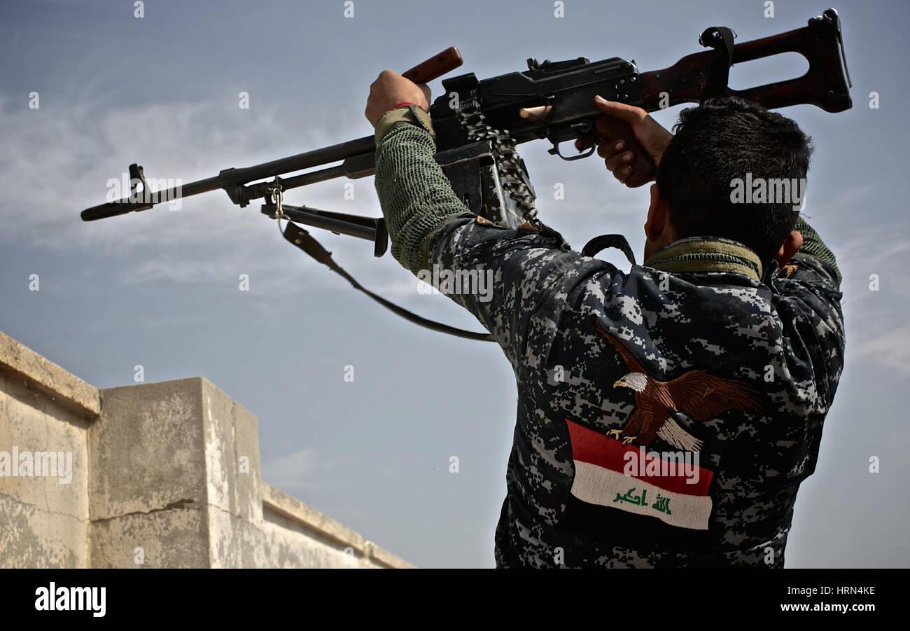 Mosul, Iraq. 1st Mar, 2017. Iraqi Federal Police return fire towards ...
