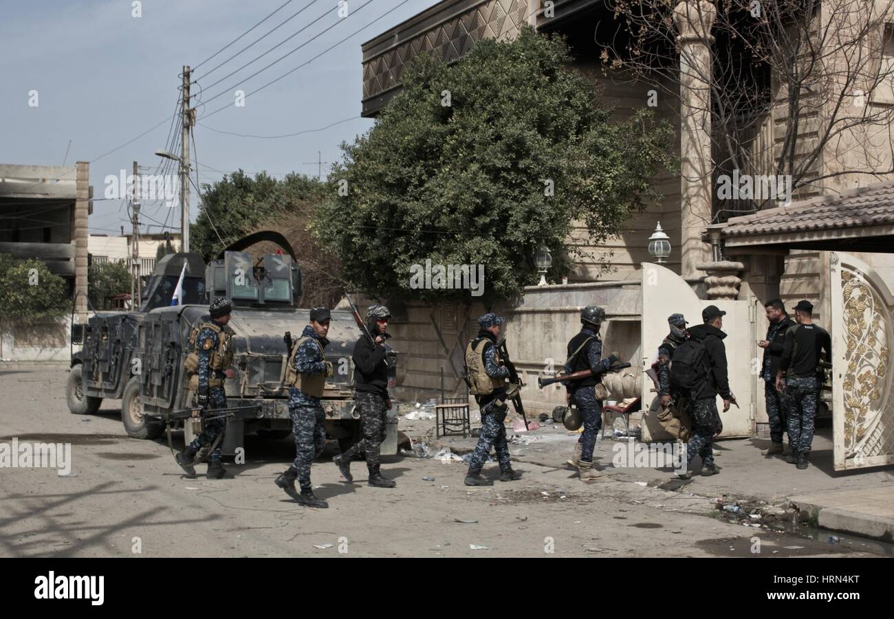 Mosul, Iraq. 1st Mar, 2017. Iraqi Federal Police return from a patrol ...