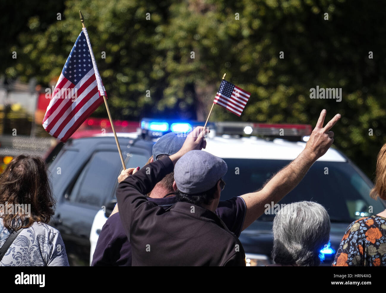 Los Angeles, California, USA. 3rd Mar, 2017. People salute as the ...