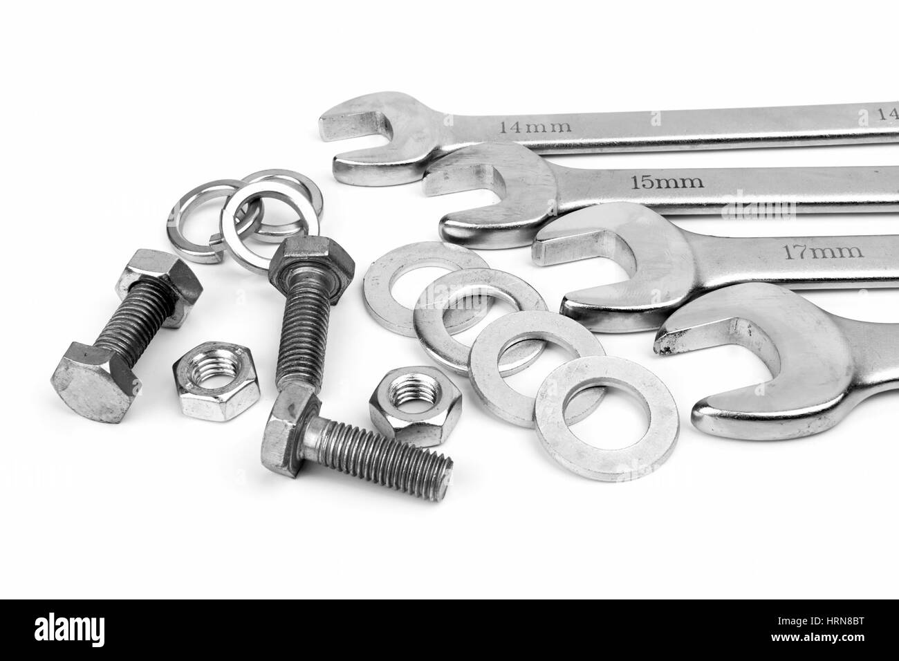 screw with spanners isolated on the white background Stock Photo - Alamy
