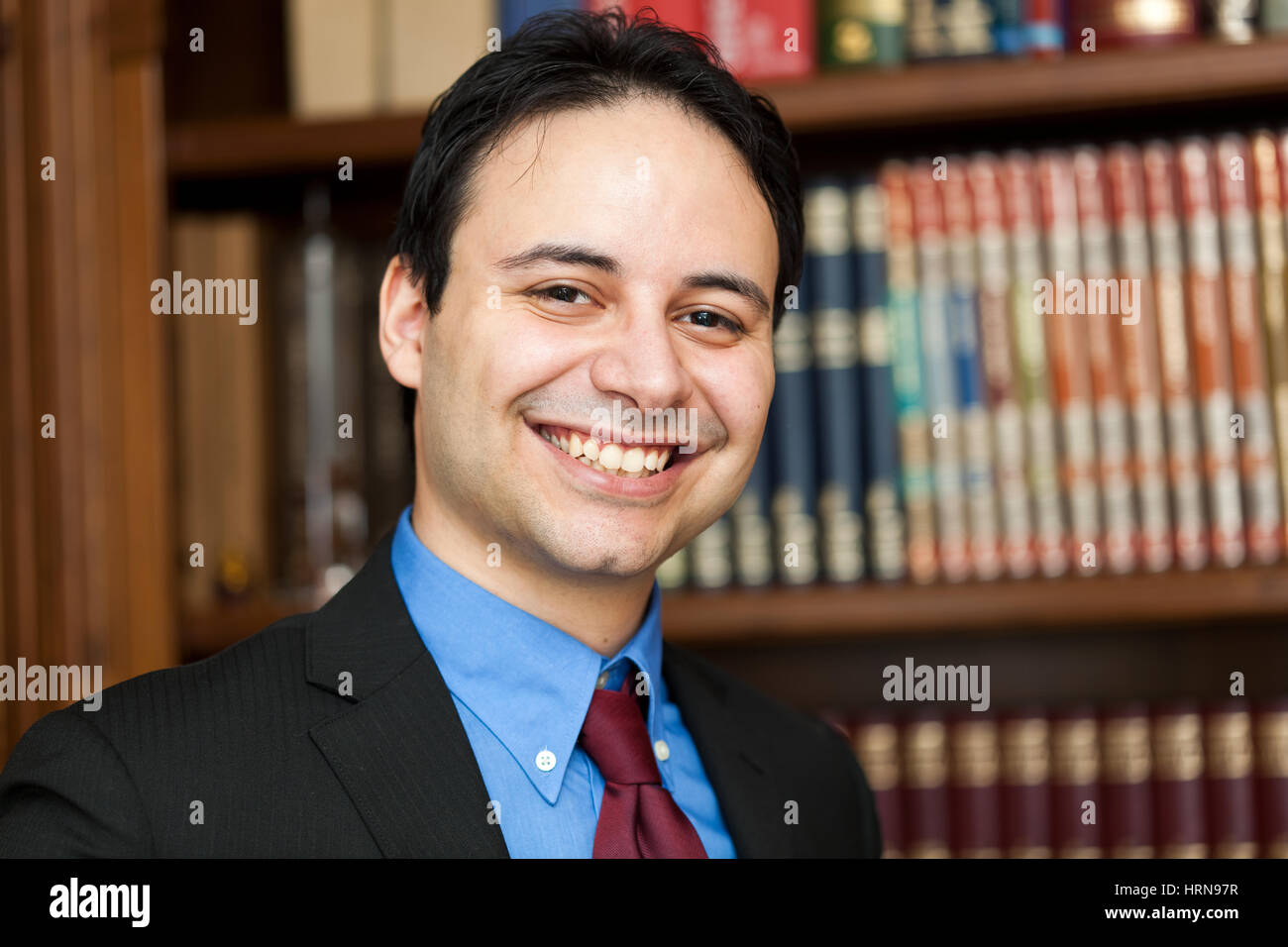 Smiling lawyer portrait in his studio Stock Photo - Alamy