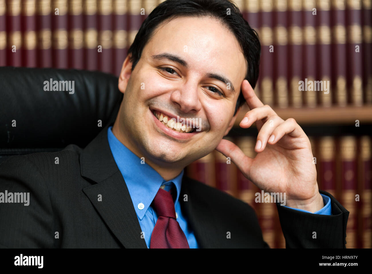 Smiling lawyer portrait in his studio Stock Photo - Alamy