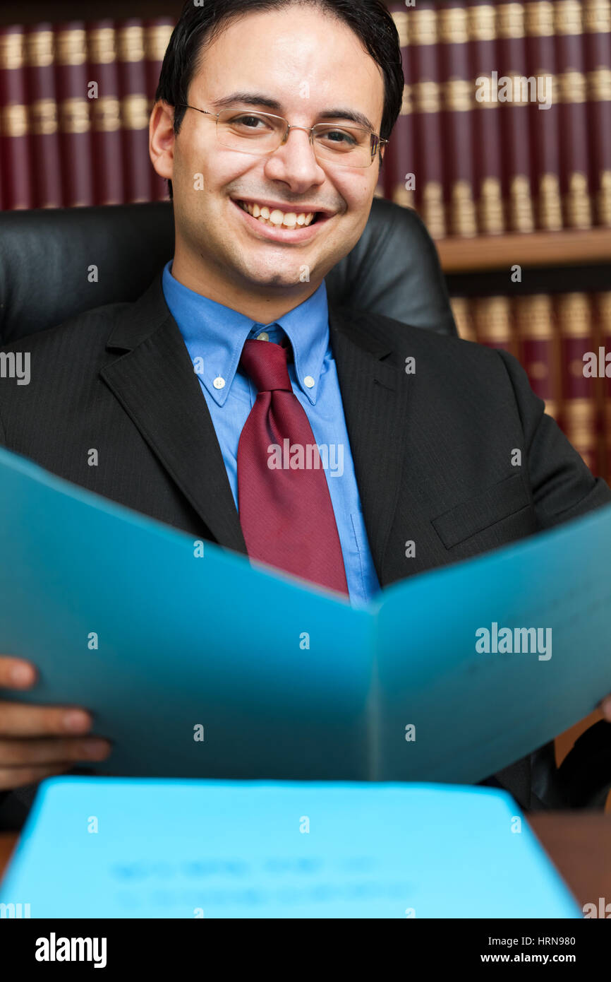 Smiling lawyer portrait working in his studio Stock Photo - Alamy