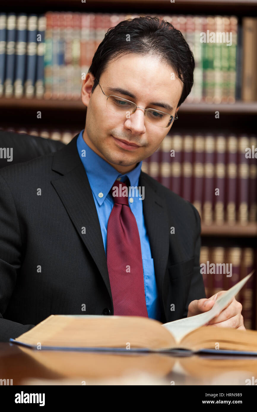 Smiling lawyer portrait reading a book Stock Photo - Alamy