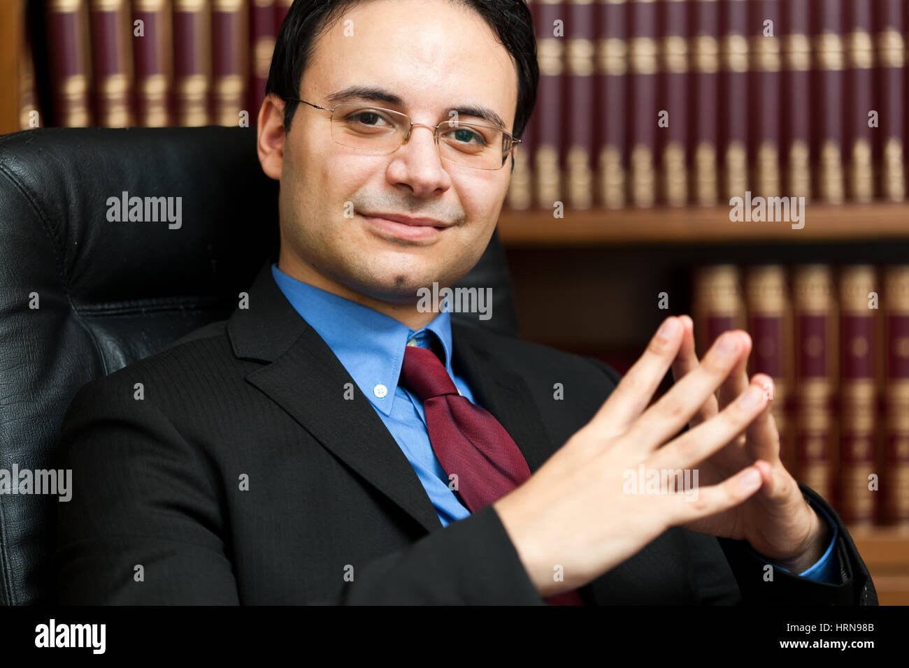 Smiling lawyer portrait in his studio Stock Photo - Alamy