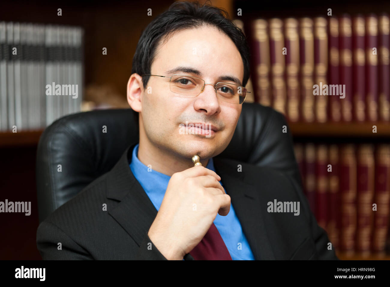 Successful lawyer portrait in his studio Stock Photo - Alamy