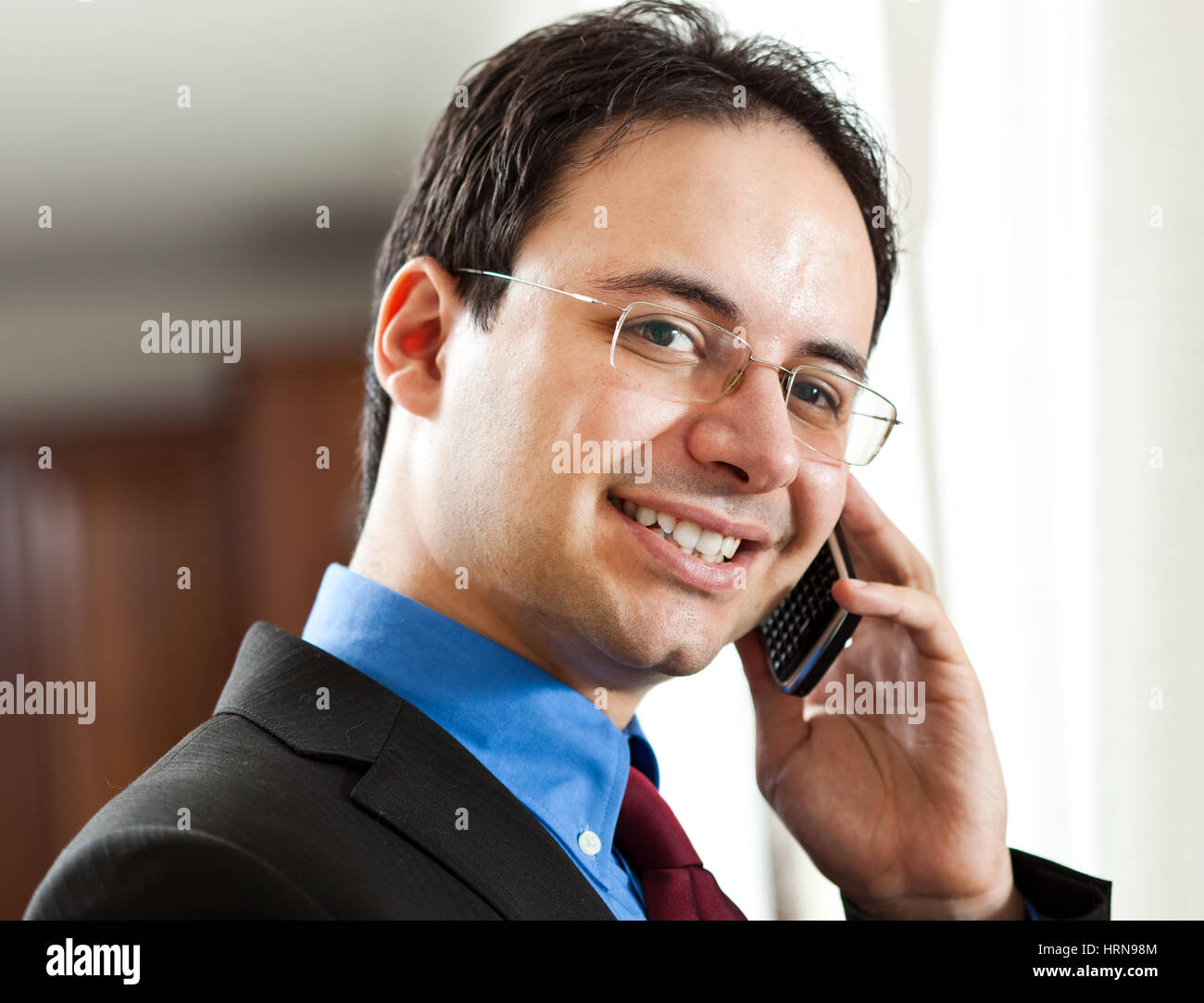 Smiling lawyer talking on the phone Stock Photo - Alamy