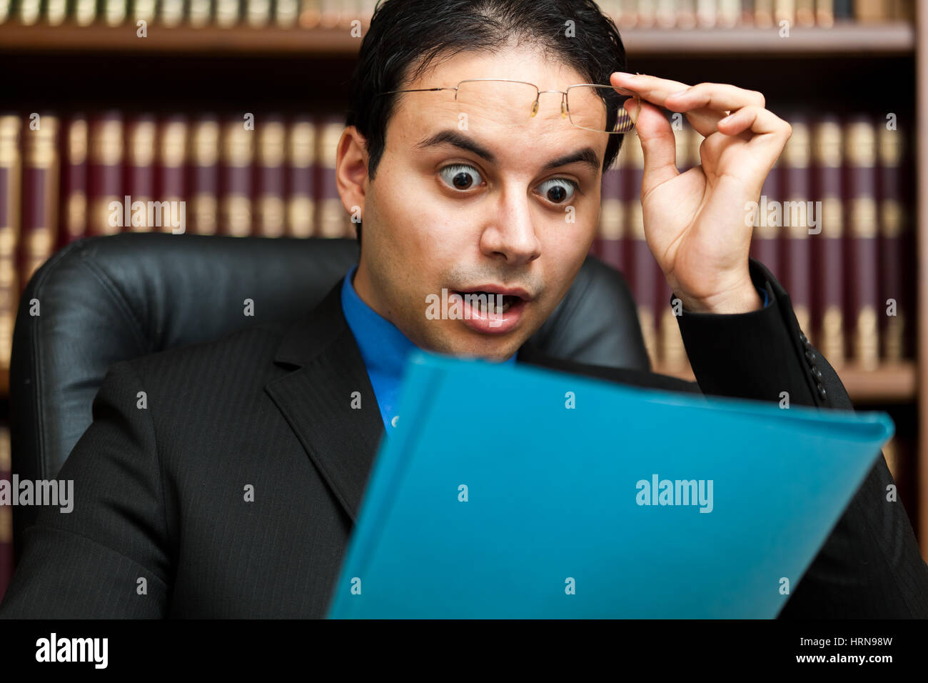 Surprised lawyer reading a document Stock Photo - Alamy